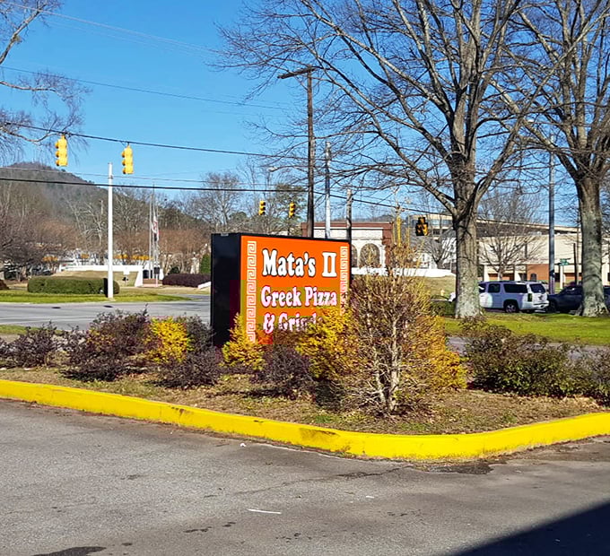 Mata's vibrant orange sign stands out like its uniquely delicious Greek-Italian fusion pies.