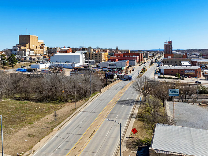 McAlester unfolds like a miniature metropolis from this bird's-eye view, where roads lead to a downtown that's been the backdrop for generations of Oklahoma stories.