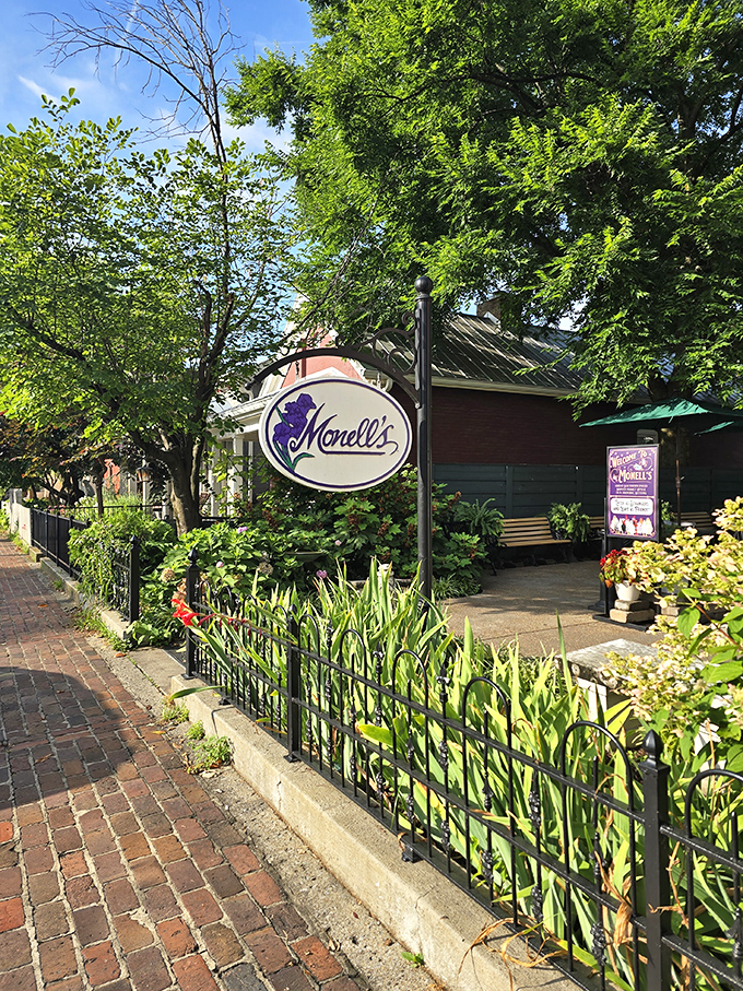 Monell's garden entrance feels like discovering a secret breakfast society hidden behind wrought iron and greenery.