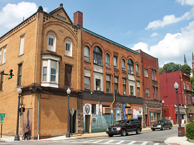 Oil City's vintage buildings line the street like a living museum, their weathered bricks and colorful storefronts creating an affordable retiree's dream.
