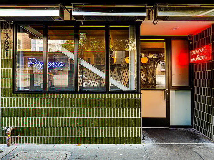 Pizzeria Delfina's sleek green-tiled exterior brings a touch of modern style to San Francisco's Mission District pizza scene.