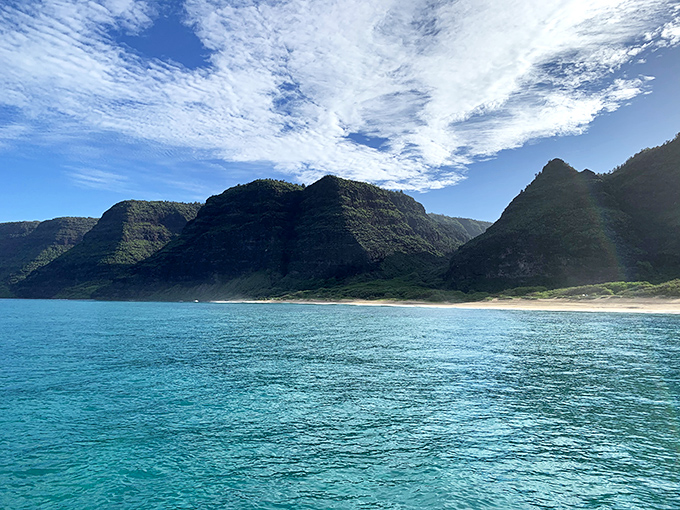 Polihale's endless golden beach stretches toward the horizon. Where Hawaii goes to escape from Hawaii!