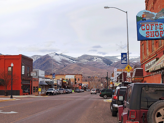 The Coffee Shop sign stands as a colorful beacon in Salmon, where mountains frame every street corner conversation.