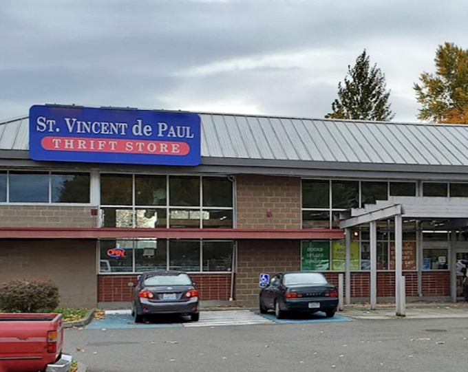 The classic blue and red St. Vincent de Paul sign has guided generations of thrift shoppers. This Renton location stands ready for your next discovery.
