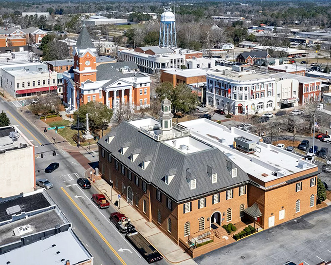 Statesboro's Main Street glows with afternoon light, transforming everyday storefronts into something magical as evening approaches.