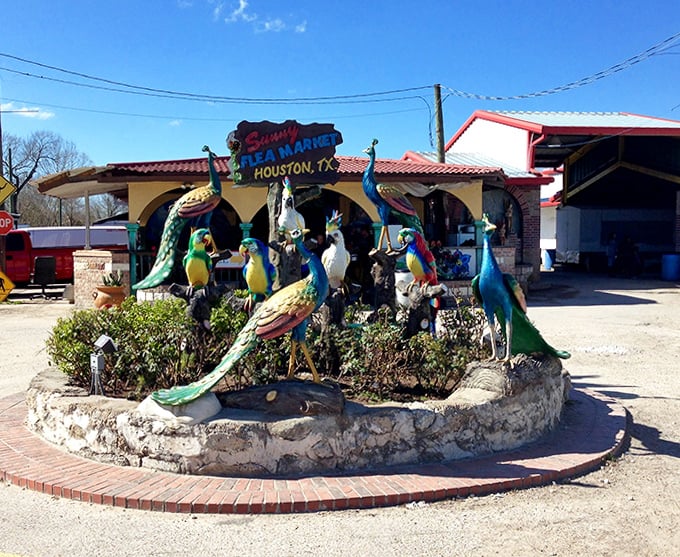 Tropical welcome to a world of wonders! Sunny Flea Market's colorful bird sculptures greet visitors with exotic flair.