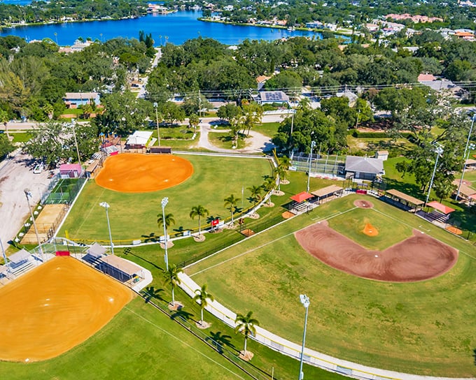 Tarpon Spings lakeside baseball fields gleam in the afternoon sun, backed by water so blue it competes with the sky.