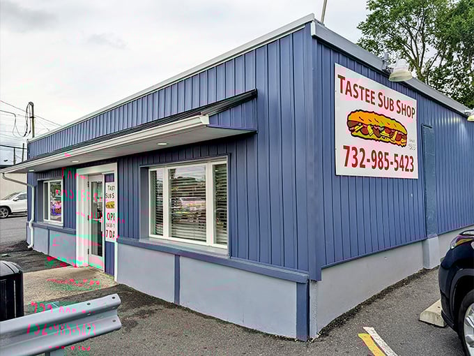 Tastee's blue siding stands out like a sandwich oasis. This little building has satisfied hunger pangs for decades.