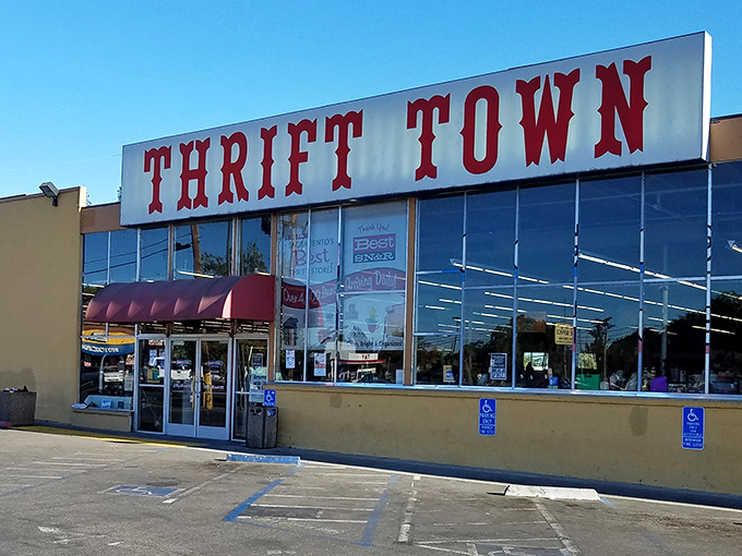 Thrift Town's bold red letters announce a playground for bargain hunters. That awning offers shade for shoppers eager to explore.