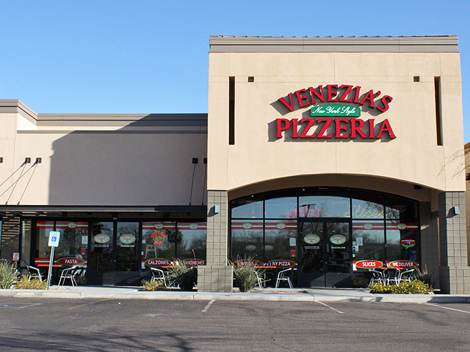 Venezia's bold sign promises New York pizza without the subway fare. Big Apple flavor in the Arizona desert!