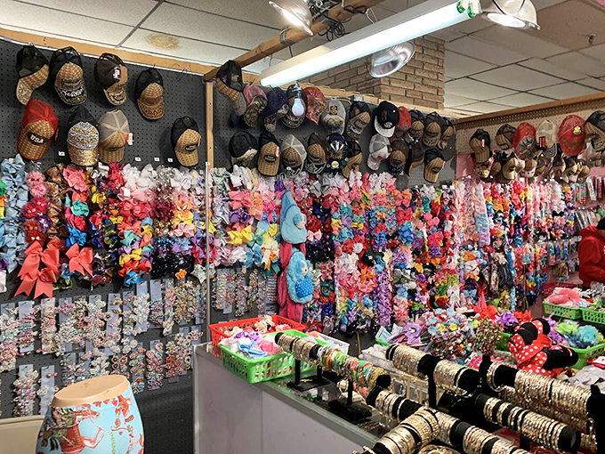 A rainbow explosion of hair accessories and hats! This vendor booth is like stepping into your crafty aunt's dream closet.