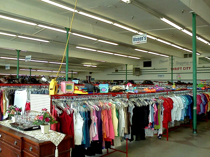 Inside reveals the organized chaos of thrift paradise&mdash;color-coded racks stretching toward fluorescent horizons.