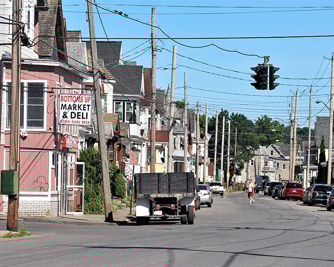 "Bottoms Up Market & Deli" says it all&mdash;Amsterdam's unpretentious neighborhoods offer the kind of authentic community living that Manhattan money can't buy.