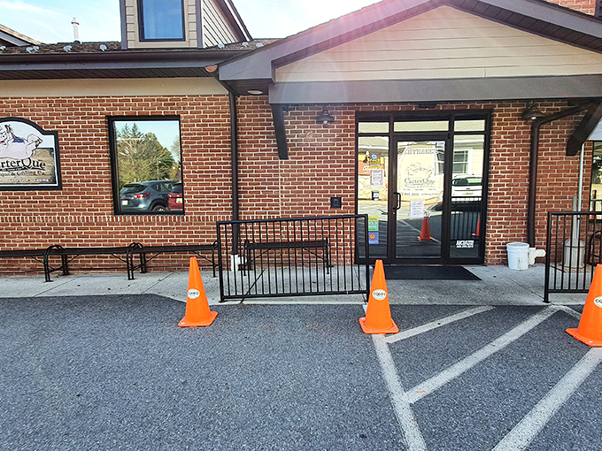 The neat brick exterior of CarterQue hides a world where smoke and time transform ordinary meat into extraordinary memories.