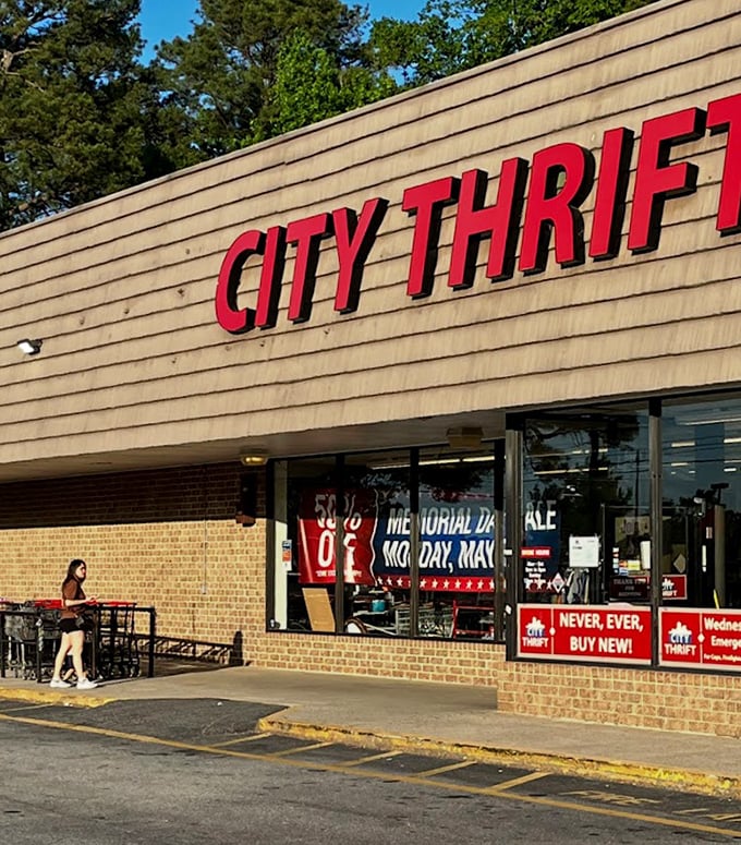 City Thrift's bold red lettering against wooden siding - like a billboard advertising "Adventure in Secondhand Shopping."