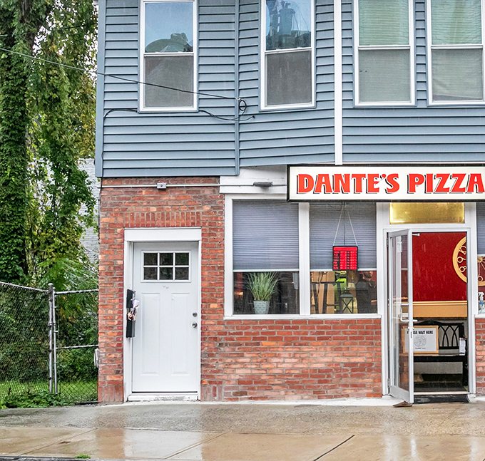 Dante's Pizza: Clean lines, brick foundation, and that perfectly lit interior - the pizza equivalent of finding the light at the end of the tunnel.