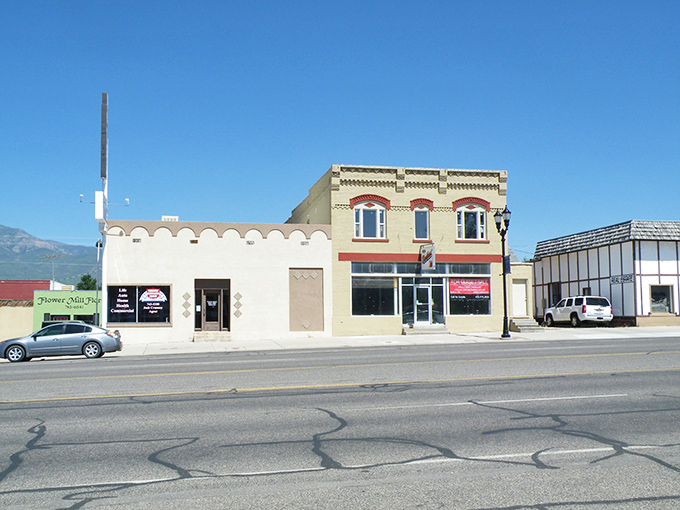 Fillmore&rsquo;s main street features a mix of simple storefronts and older facades, offering a laid-back snapshot of everyday small-town life under wide Utah skies.