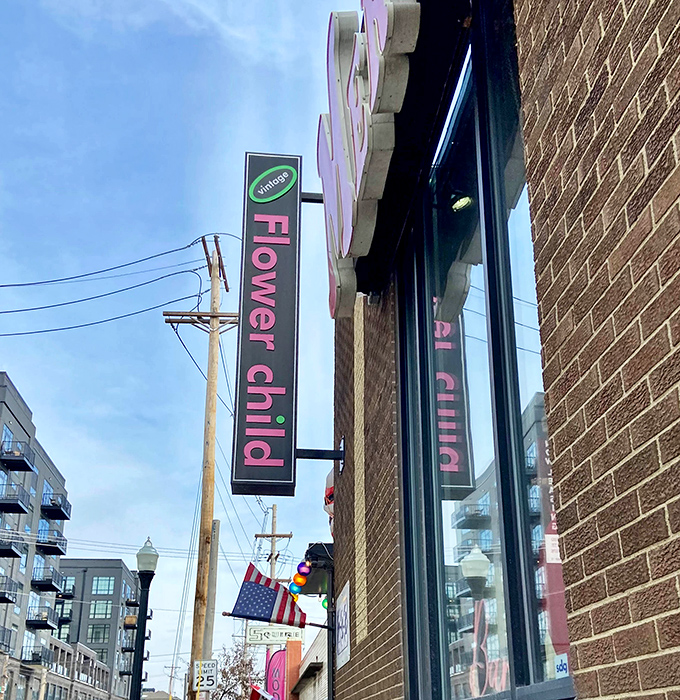 Flower Child's vintage sign promises a trip back in time, where bell bottoms and vinyl records are always in style.