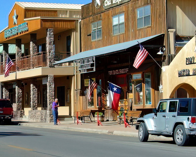 The western-style storefronts of Fort Davis invite visitors to step back in time, complete with Texas flags and frontier hospitality.
