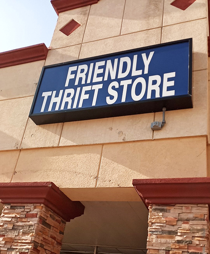 That blue sign against textured beige is like the perfect vintage brooch &ndash; simple, elegant, and promising treasures that tell stories.