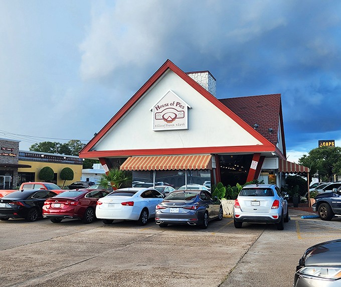 Even on cloudy days, House of Pies' cheerful red-trimmed building brightens the Houston landscape.