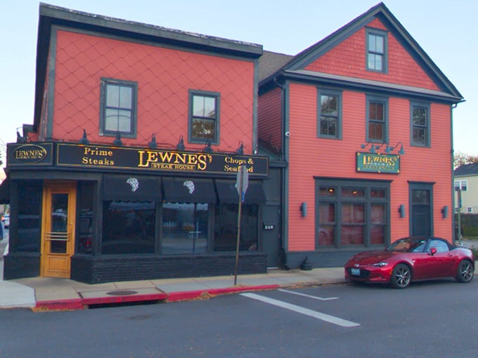 Evening settles around Lewnes' distinctive red building in Eastport. That classic facade has welcomed generations of steak enthusiasts.