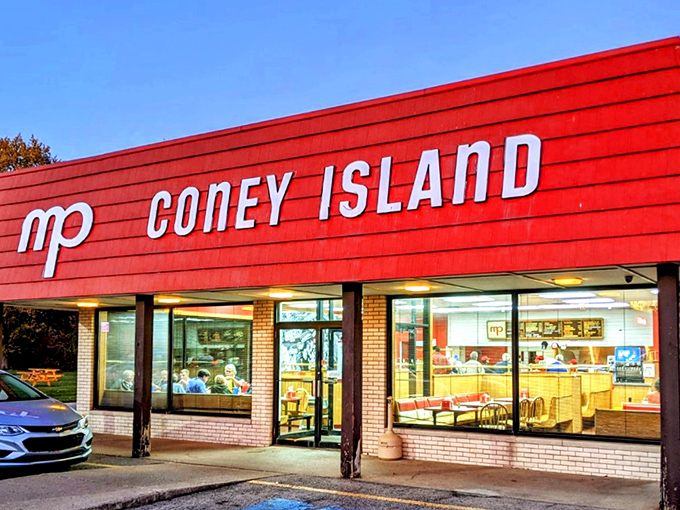 When the sun sets, M+P Coney Island lights up like a hot dog paradise, beckoning hungry travelers inside.