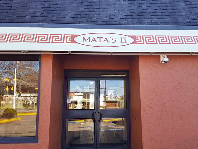 That Greek key pattern isn't just decoration &ndash; it's a promise of Mediterranean flavors that redefine pizza.