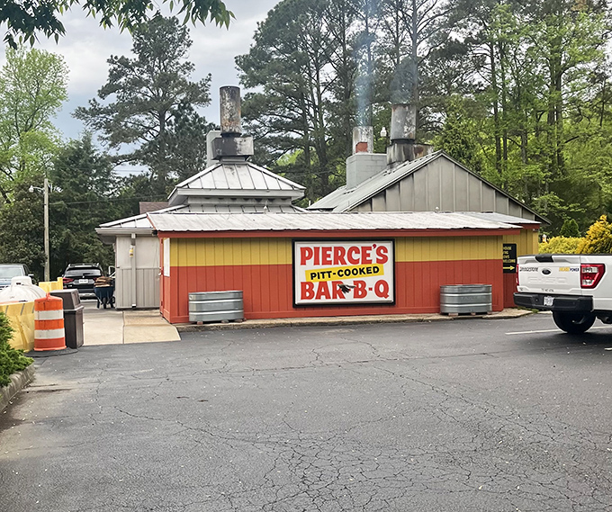 The weathered exterior tells stories of countless satisfied customers and perfectly smoked Virginia barbecue traditions. 