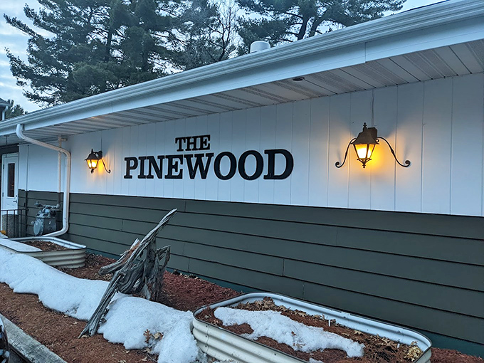 Winter transforms Pinewood into a snow-globe of dining delight. Those warm lights promise cozy comfort and sizzling steaks inside.