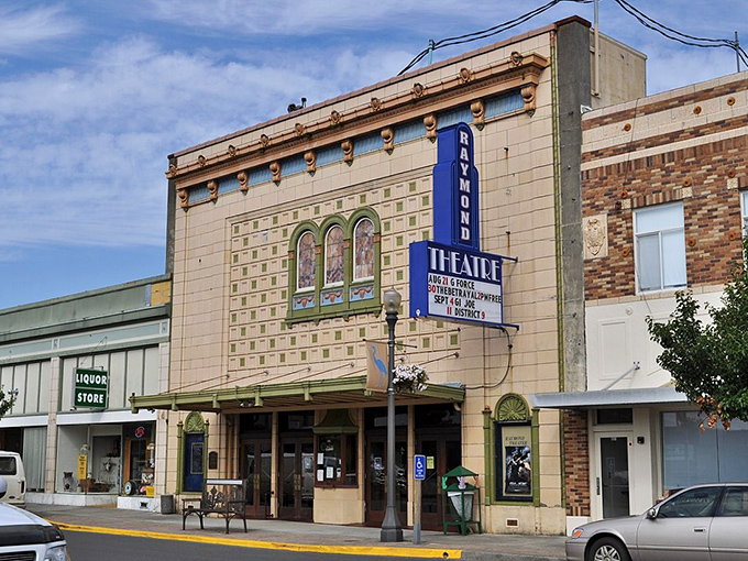 Raymond's historic theater marquee advertises entertainment at prices that seem delightfully stuck in the past.