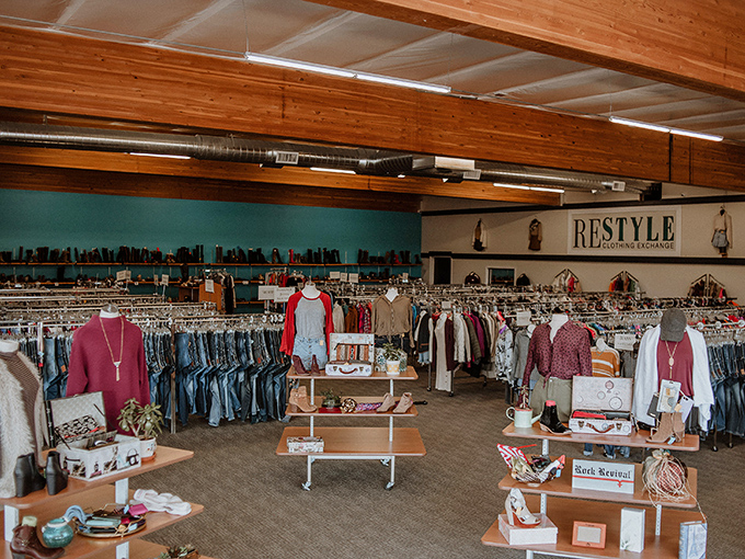 Organized clothing racks stretch endlessly, creating a secondhand paradise for style-conscious shoppers everywhere.