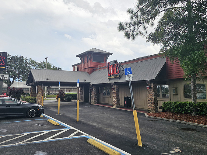 Stone accents and wooden beams signal comfort food territory ahead. This is where BBQ dreams and stretchy pants become necessary companions.