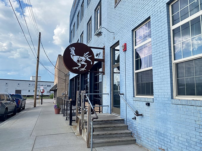 This quirky exterior with its rooster mascot hints at the hearty, satisfying pizza waiting just inside. 