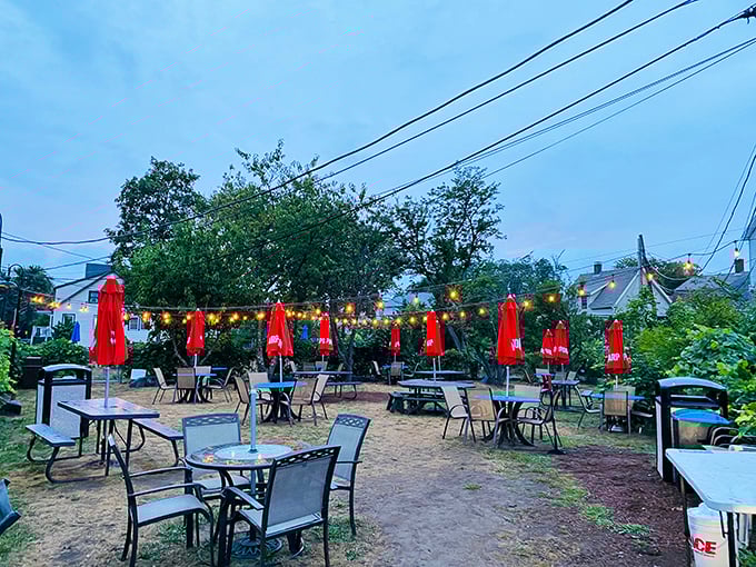 Tony's outdoor dining area glows with string lights at dusk. Those red umbrellas have sheltered countless happy diners enjoying ocean breezes with their seafood.