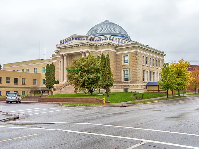 This stately courthouse stands like a proud centerpiece, surrounded by the kind of civic architecture that makes small towns feel important.