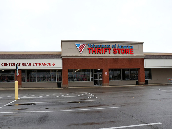 Follow the signs to savings! This rain-kissed VOA storefront in Columbus offers directional guidance to the treasure-filled promised land.