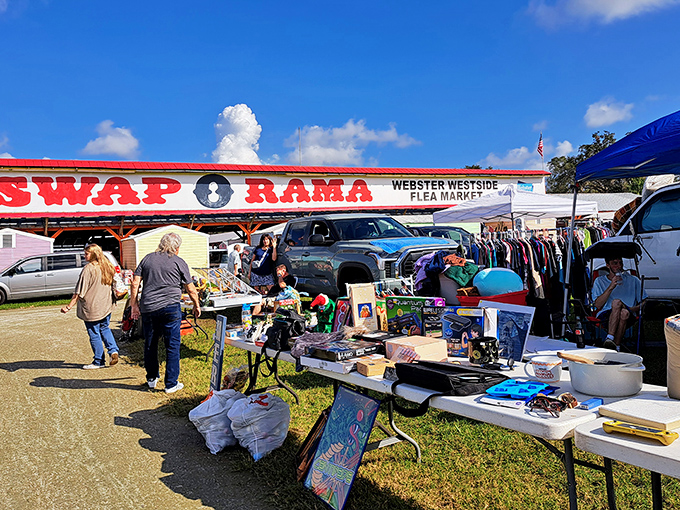 Bargain bonanza! Shoppers browse outdoor tables where yesterday's forgotten items become today's exciting discoveries.