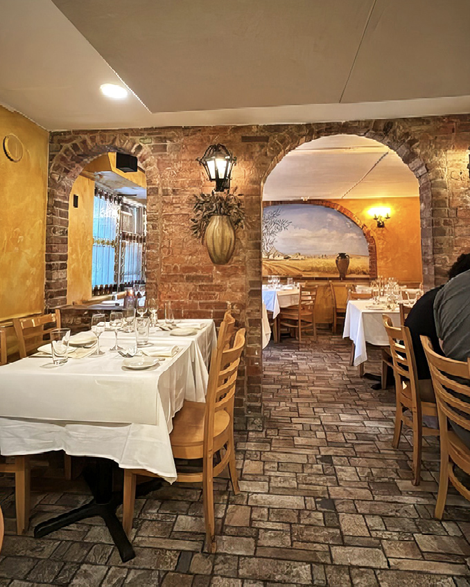 Step through the door and suddenly you're in Italy. Those stone archways and warm yellow walls aren't just d&eacute;cor&mdash;they're time travel portals to Tuscany.