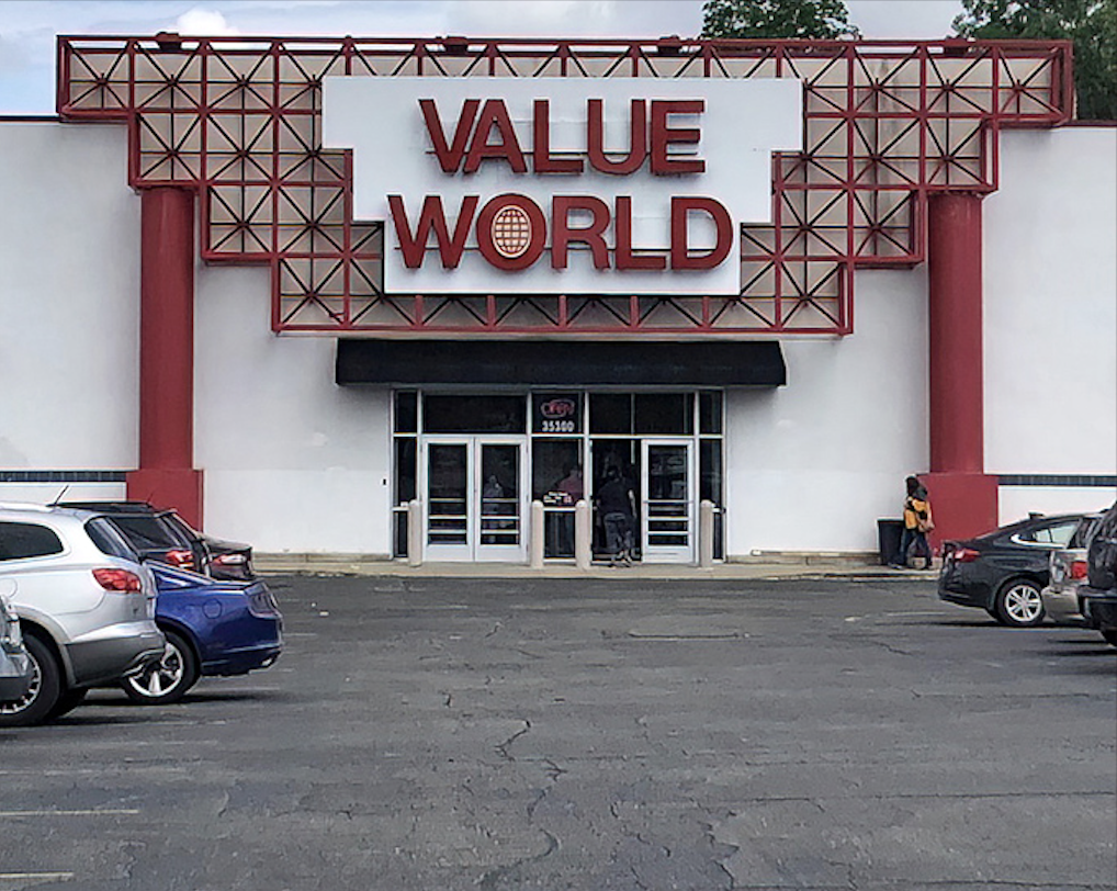 Value World's dramatic red entrance frame could double as a Broadway set. It's the perfect gateway to a wonderland of second-hand finds.