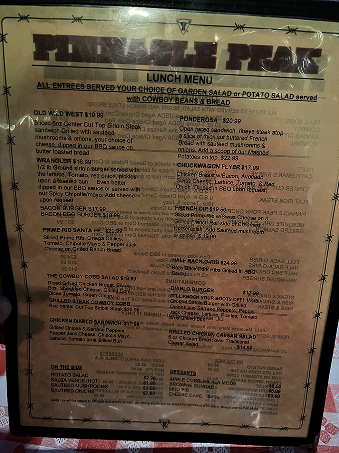 The menu reads like a love letter to meat lovers. Framed in barbed wire, it promises cowboy-sized portions that'll make your cardiologist wince.