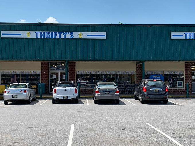 The storefront stands like a treasure chest in disguise, its teal awning and brick facade hiding a wonderland of affordable finds within.