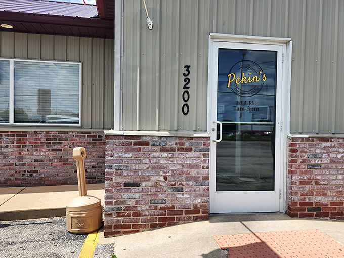 That burgundy roof and simple signage might not scream "culinary destination," but locals know this doorway leads to breakfast paradise.