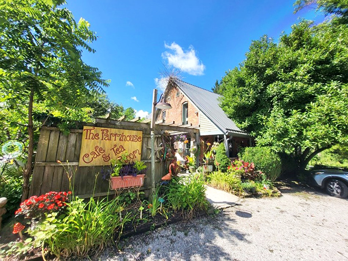 The approach to Farm House Caf&eacute; feels like discovering a secret garden hideaway, where nature and nostalgia conspire to welcome hungry travelers with colorful blooms and rustic charm.