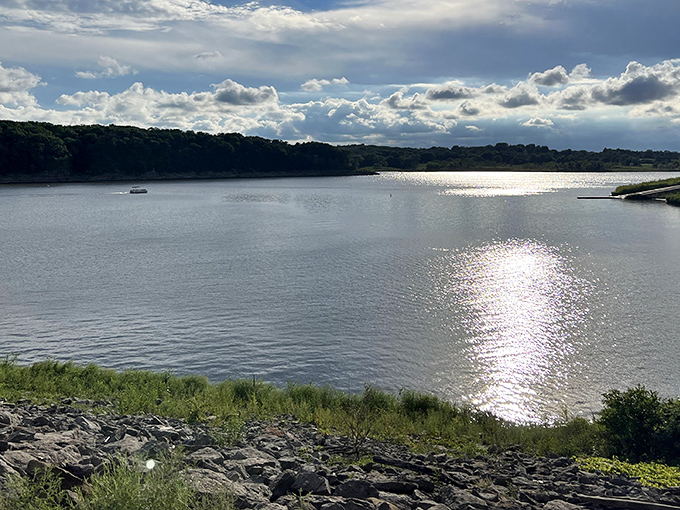 Sunlight dancing across Lake Macbride like nature's disco ball, proving Iowa knows how to throw a spectacular light show.