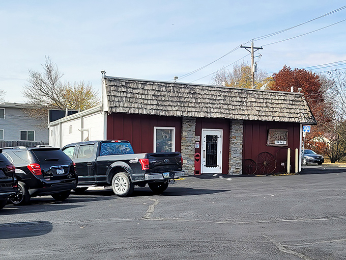 The unassuming red exterior with its distinctive shingled roof &ndash; Iowa's version of a treasure chest disguised as a humble cabin.