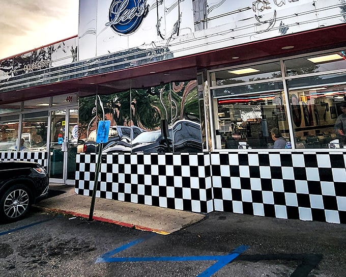 The iconic checkered exterior of Lee's Diner gleams in the sunlight, its chrome façade reflecting Hammond's vibrant community spirit.