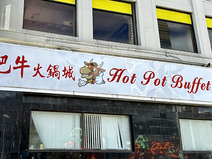 The bright red signage of Hot Pot Buffet stands as a beacon in Boston's Chinatown, promising culinary adventures that transcend language barriers.