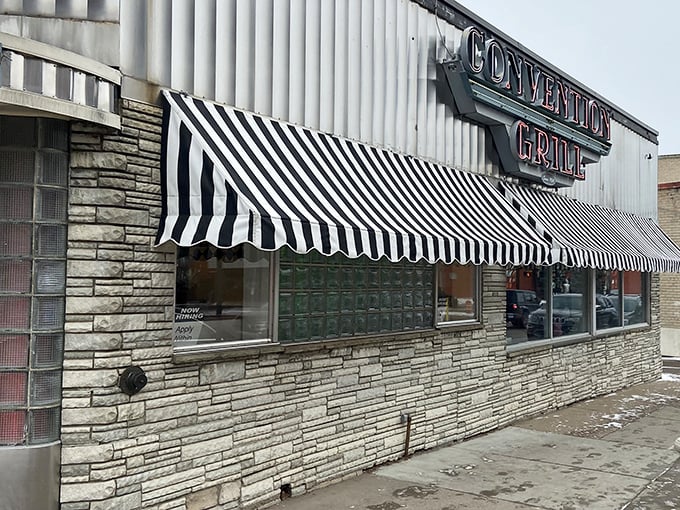 The black and white striped awnings aren't just for show—they're like time-travel portals to an era when diners ruled American cuisine and Elvis was king.
