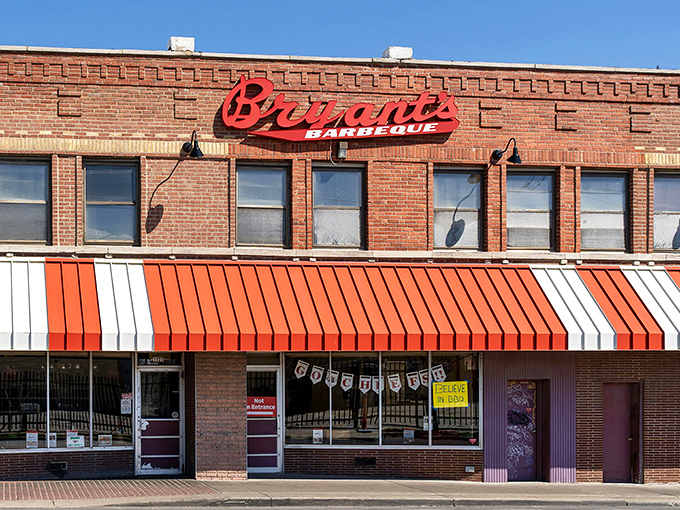 The iconic red sign against brick says everything you need to know: barbecue royalty lives here. No palace, just pure Kansas City tradition.